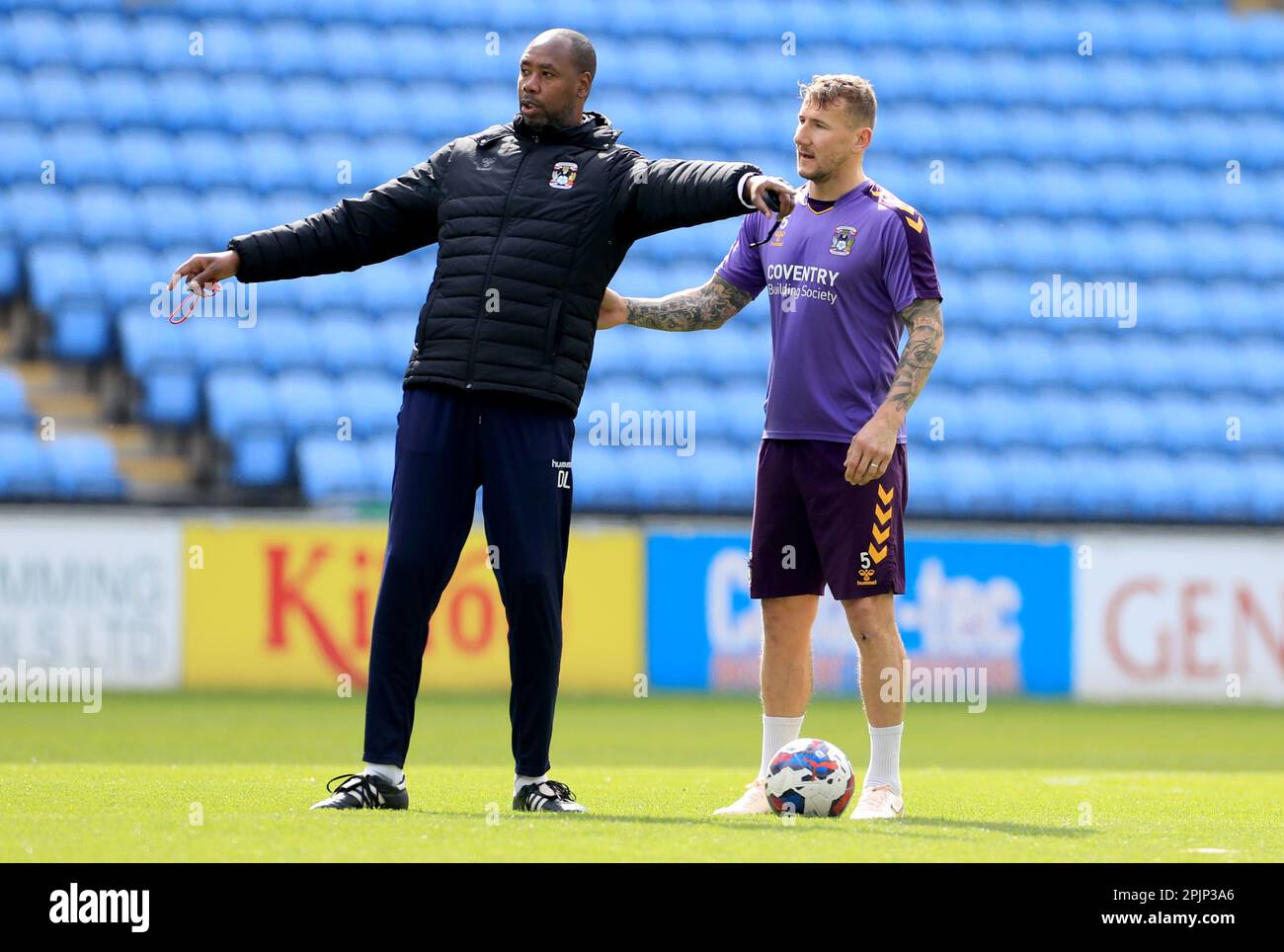 Coventry City coach Dennis Lawrence (left) and Kyle McFadzean during ...