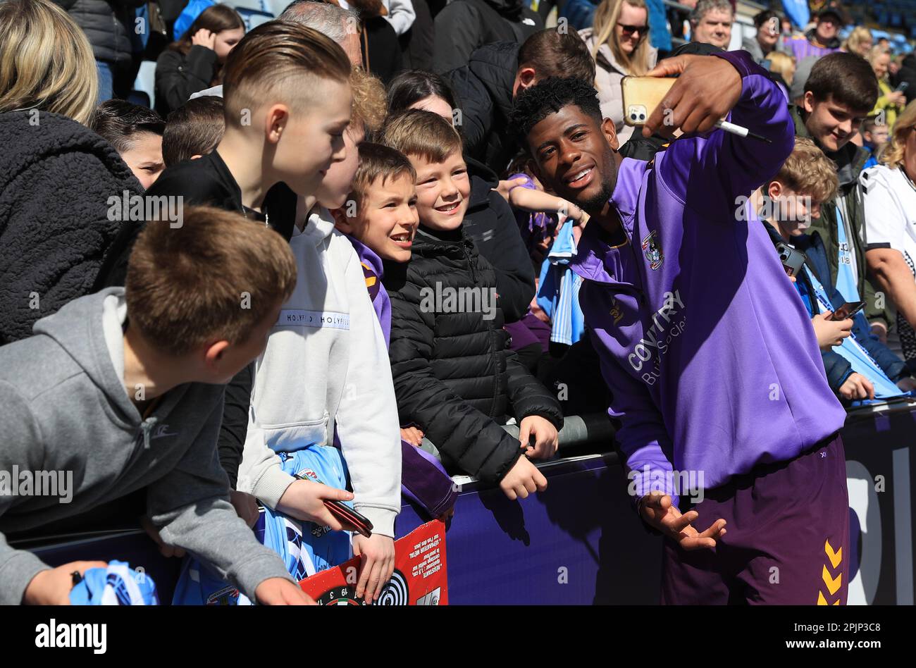 Coventry City's Jonathan Panzo takes a selfie with a fan after training ...