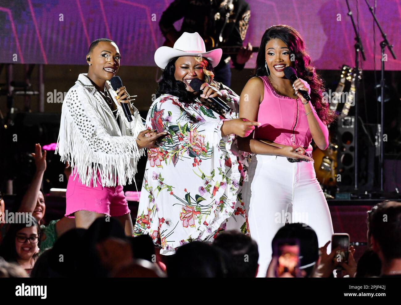 Trea Swindle, left, Danica Hart and Devynn Hart of Chapel Hart perform ...