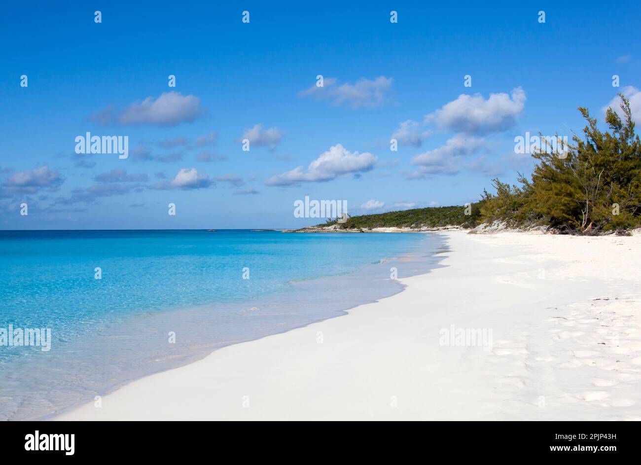 The morning view of an empty beach and turquoise color calm waters on ...