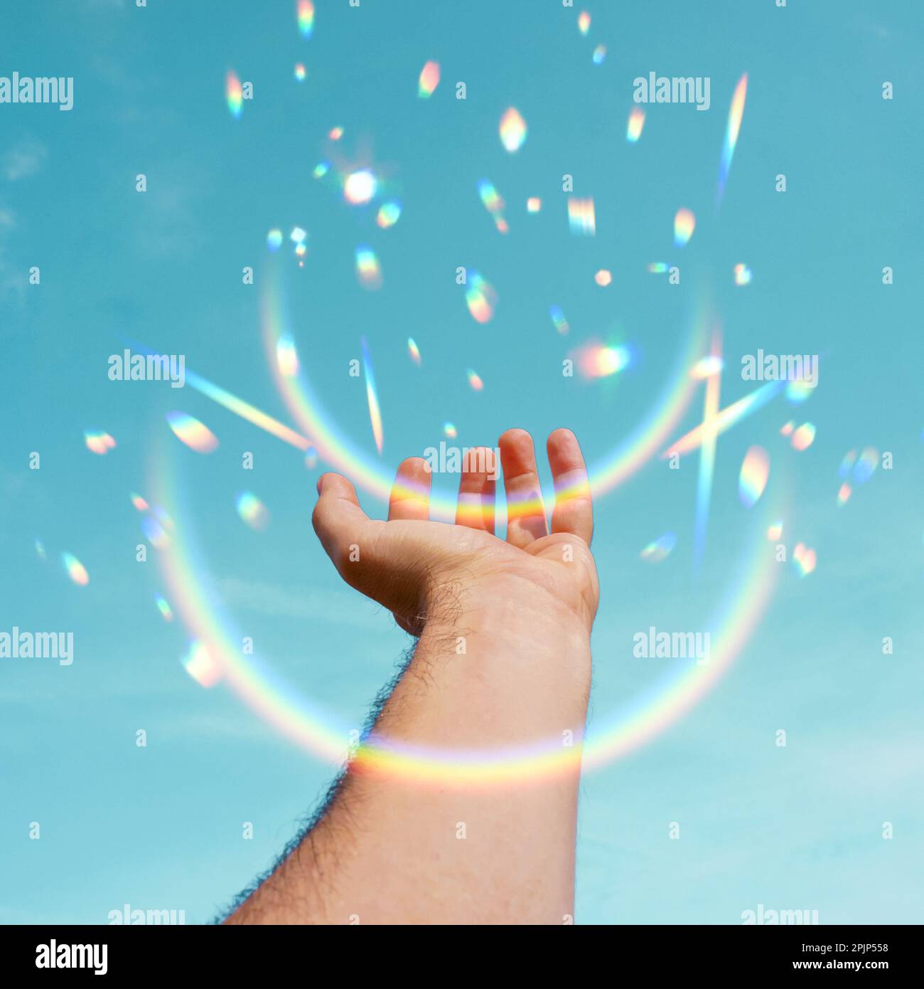 hand raised in the blue sky gesturing with the sunlight Stock Photo - Alamy