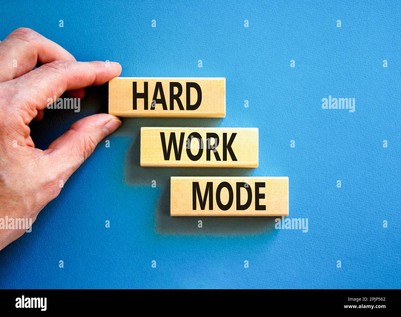 Hard work mode symbol. Concept words Hard work mode on wooden block on ...