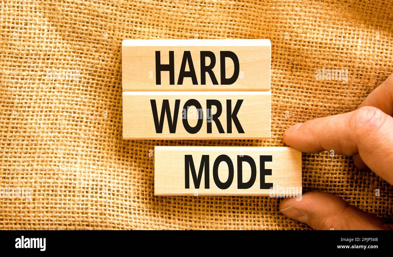 Hard work mode symbol. Concept words Hard work mode on wooden block on ...