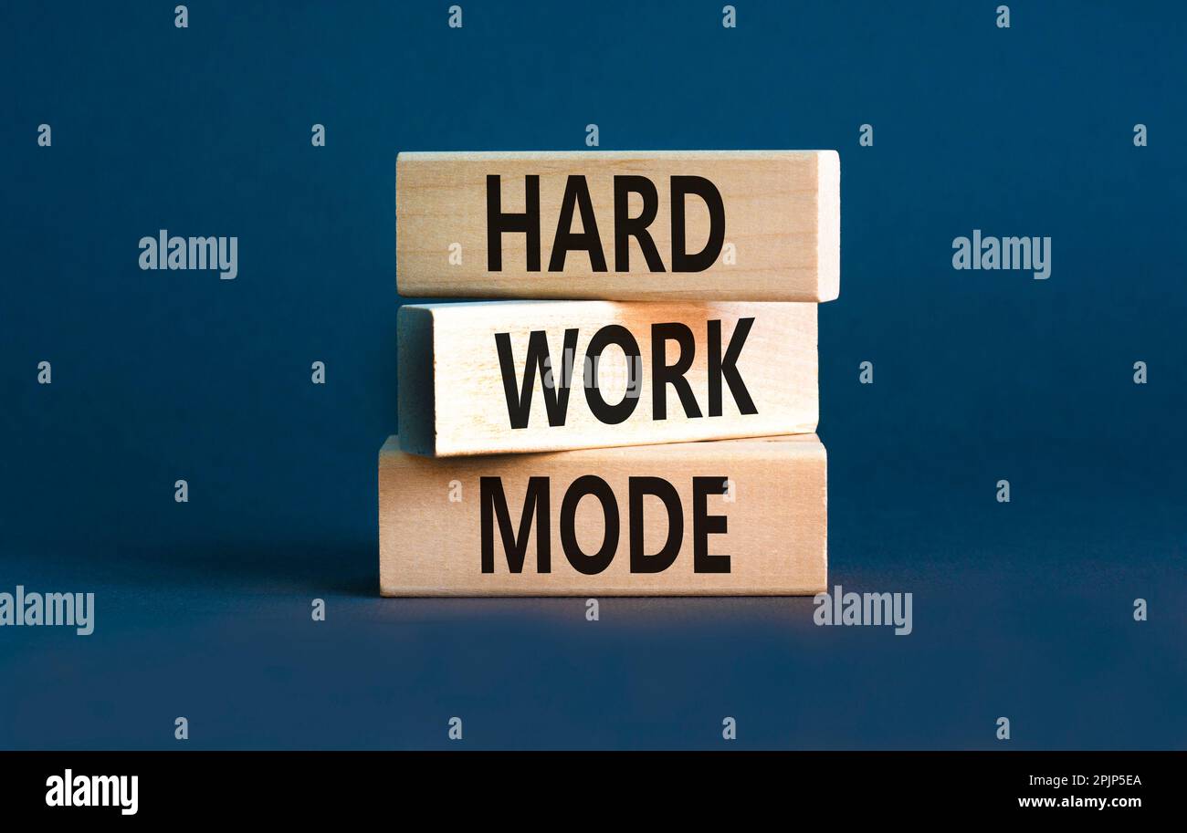 Hard work mode symbol. Concept words Hard work mode on wooden block on ...