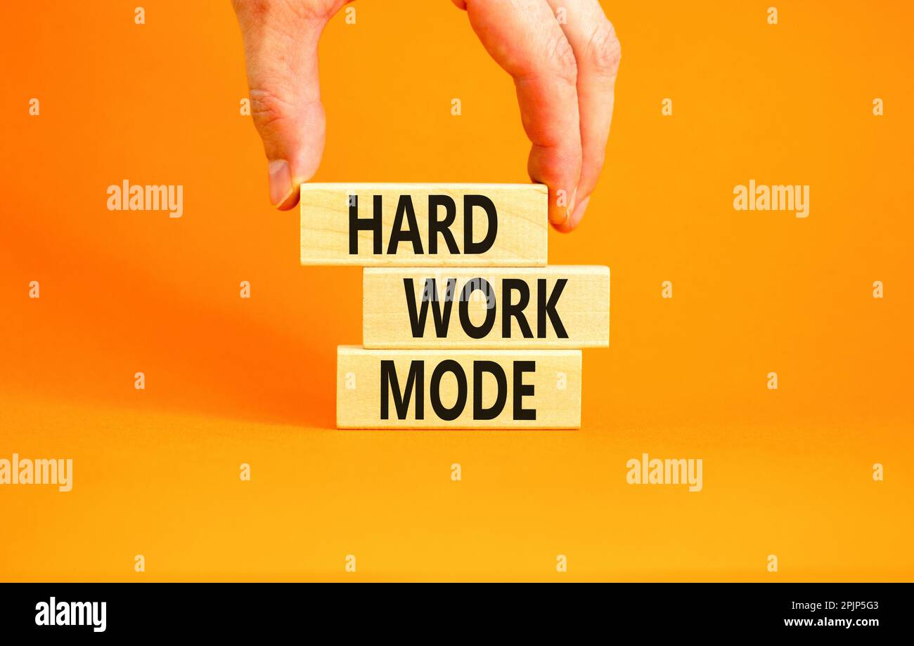 Hard work mode symbol. Concept words Hard work mode on wooden block on ...