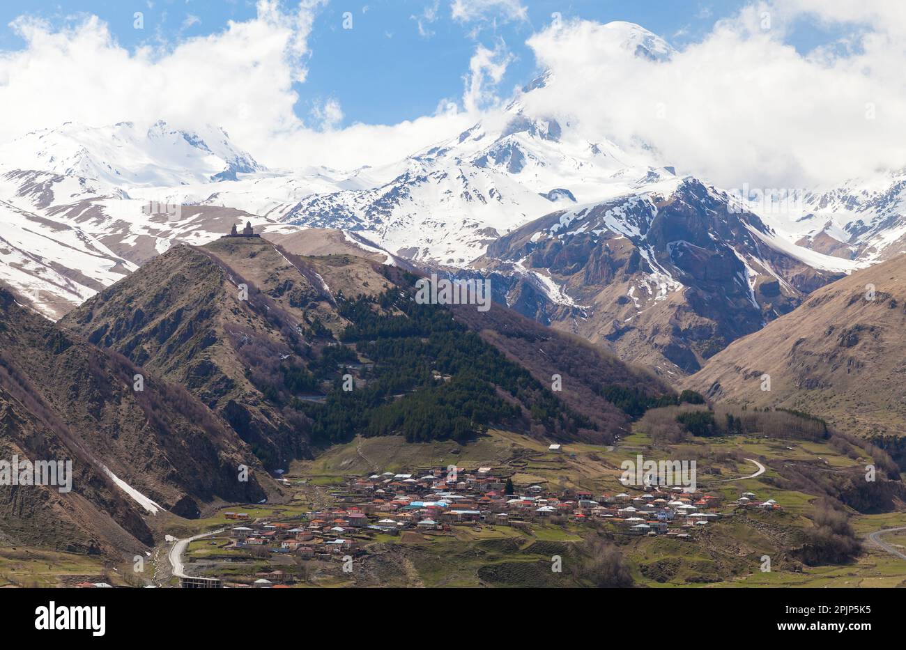 Kazbegi mountain view. Georgian landscape with Gergeti Trinity Church ...
