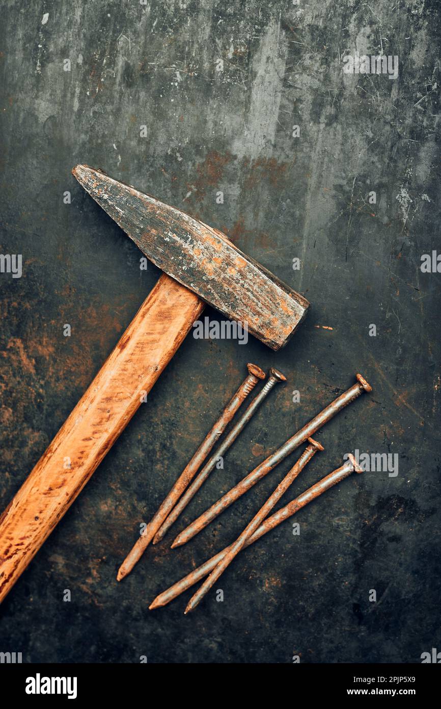 Hammer and nails on steel surface. Tools for maintenance. Hardware ...