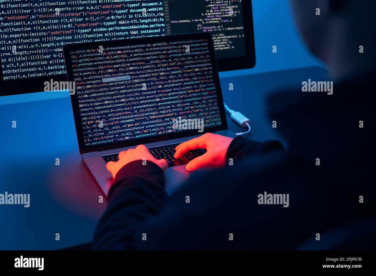 Man using computer and programming to break code. Cyber security threat. Internet and network ...