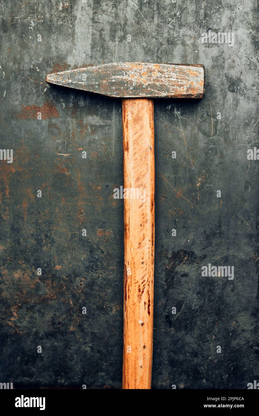 Old hammer on steel surface. Tool for maintenance. Hardware tool to fix ...