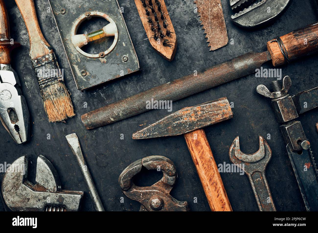Old hardware tools. Wrench, screwdriver, measure, hammer, pliers on ...