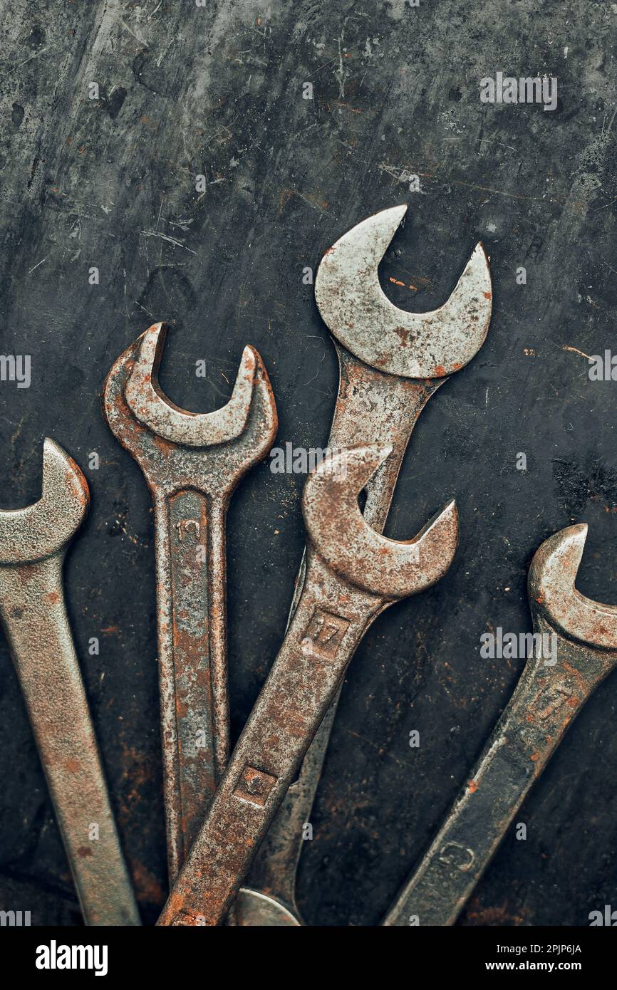 Spanners on steel surface. Old rusty wrenches for maintenance. Mechanic ...