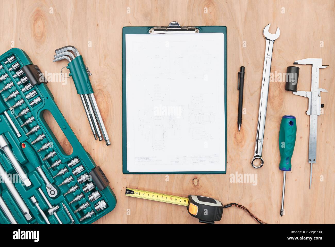 Workshop table with many tools. Wrench, spanner, calliper and ratchet ...