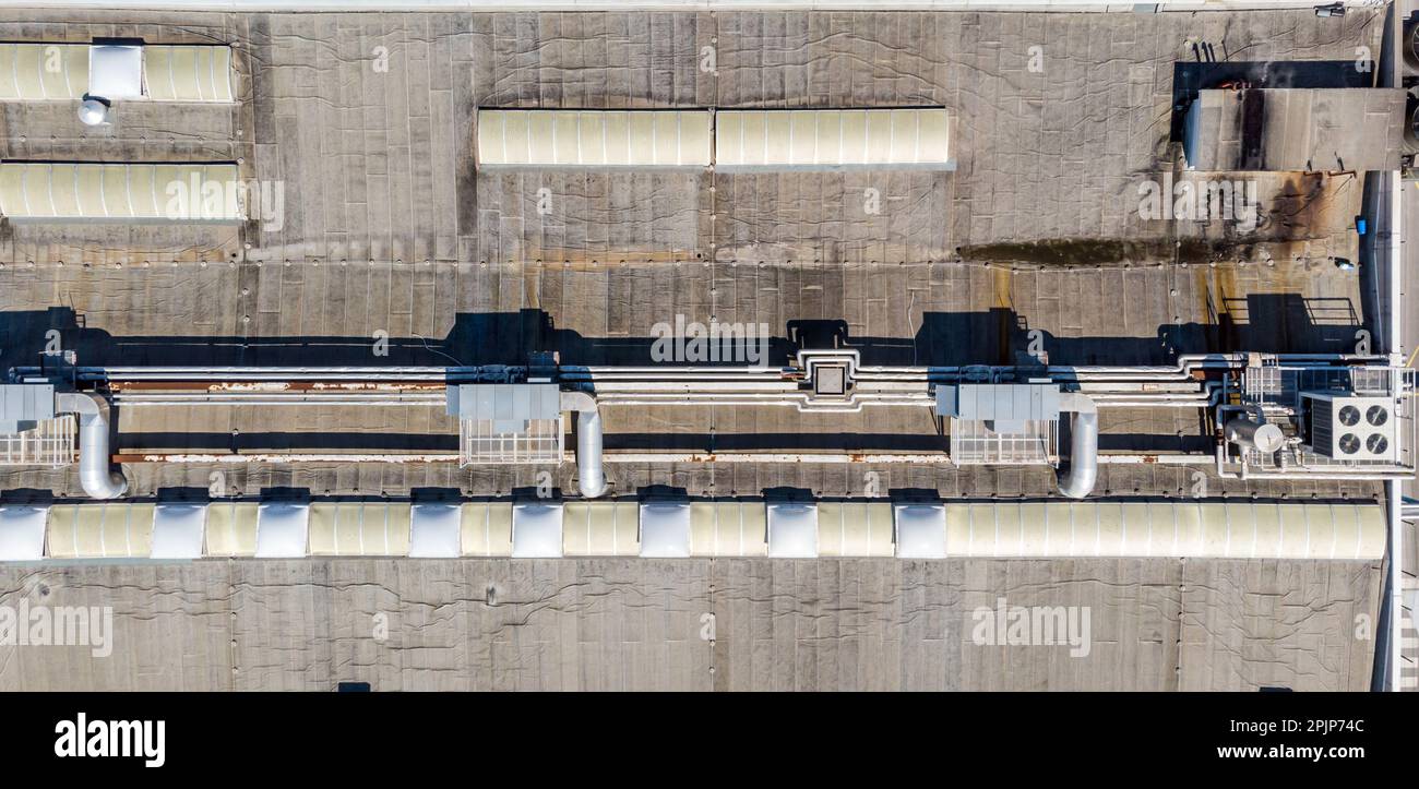 Drop down view of HVAC system with cooling pipes running along the roof ...