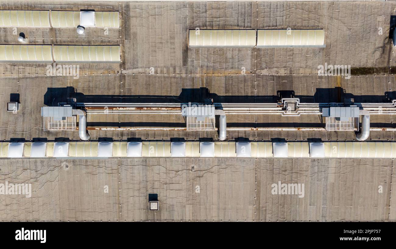 Drop down view of HVAC system with cooling pipes running along the roof ...