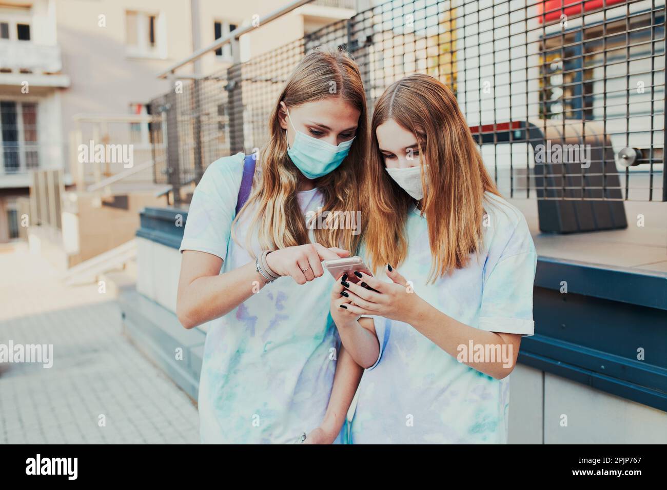 Young women girls using smartphones using social media sending texts ...