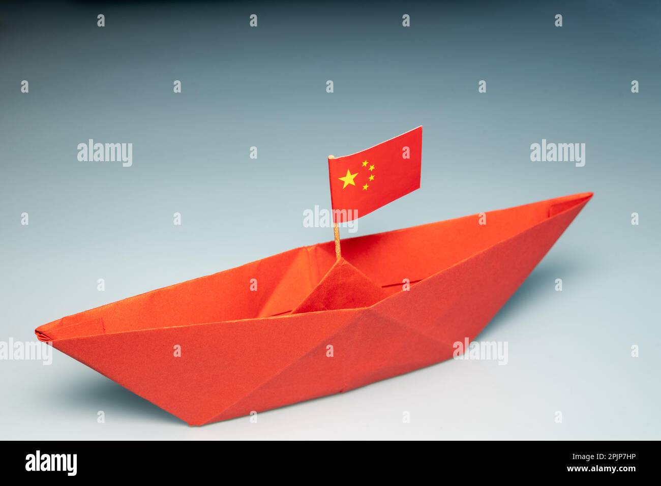 Paper red ship with China flag, China pacific fleet concept, Middle ...