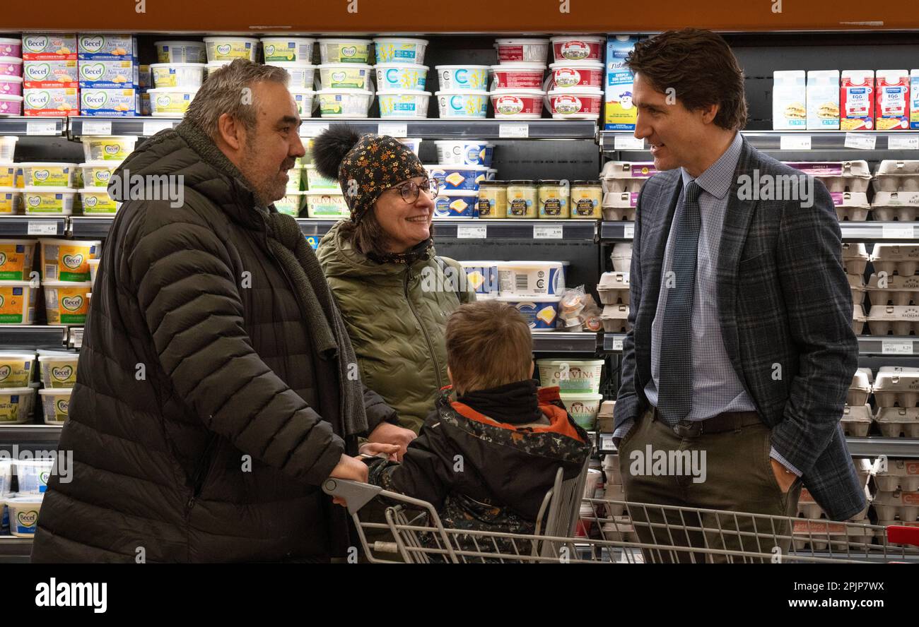 Prime Minister Justin Trudeau speaks with Sylvie Gingras and Claude ...