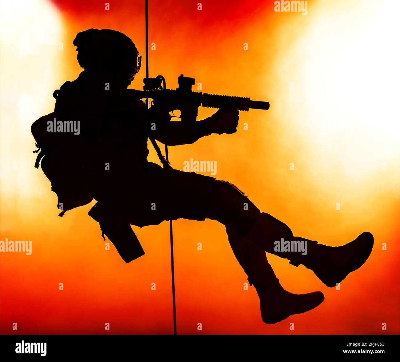 Silhouette of police officer in tactical gear descending from a height ...