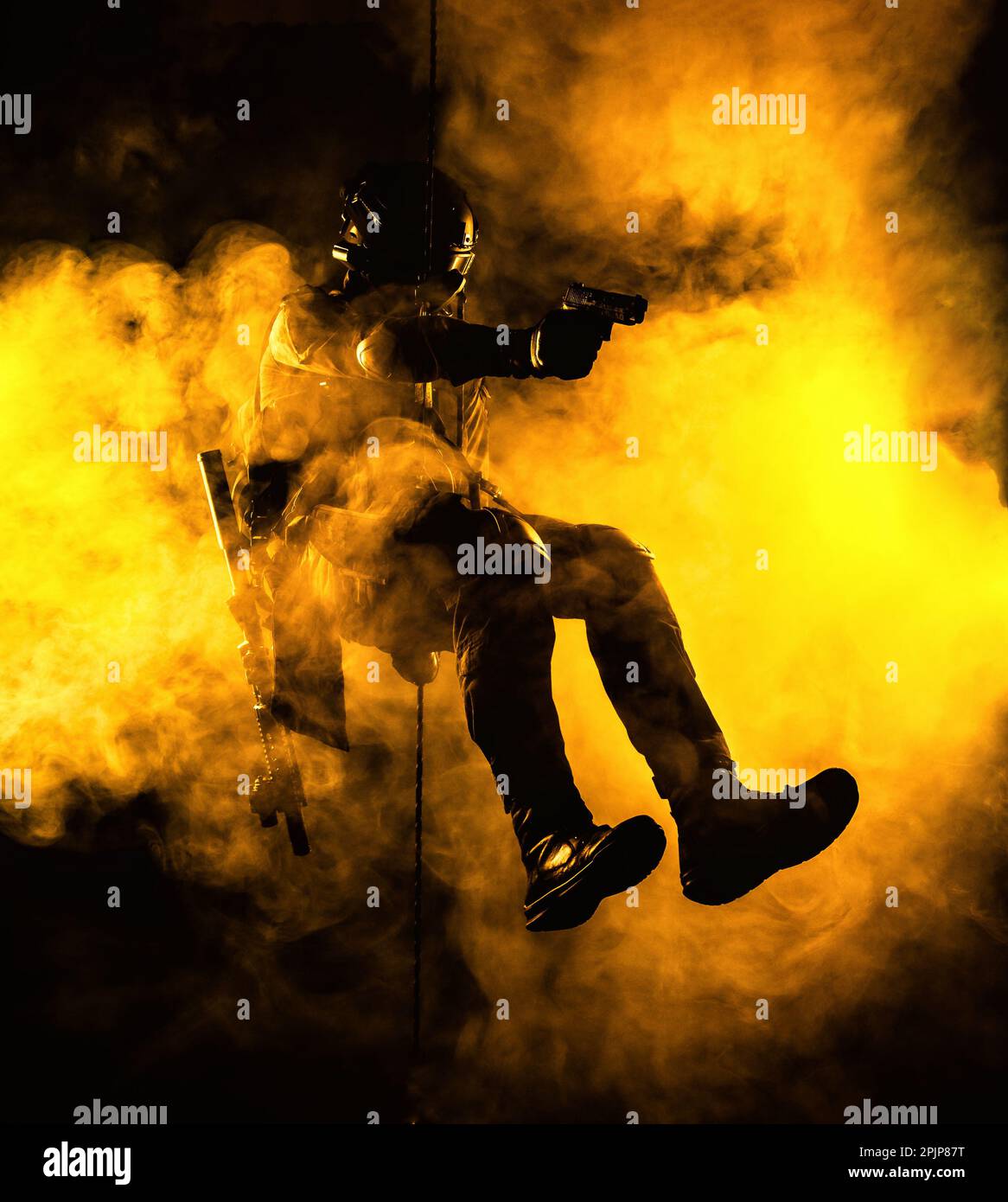 Silhouette of police officer in tactical gear descending from a height ...