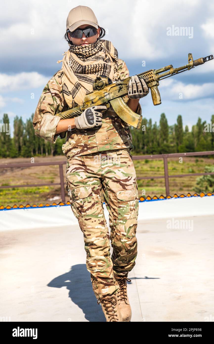 Girl with an assault rifle, strong determined, and capable woman ...