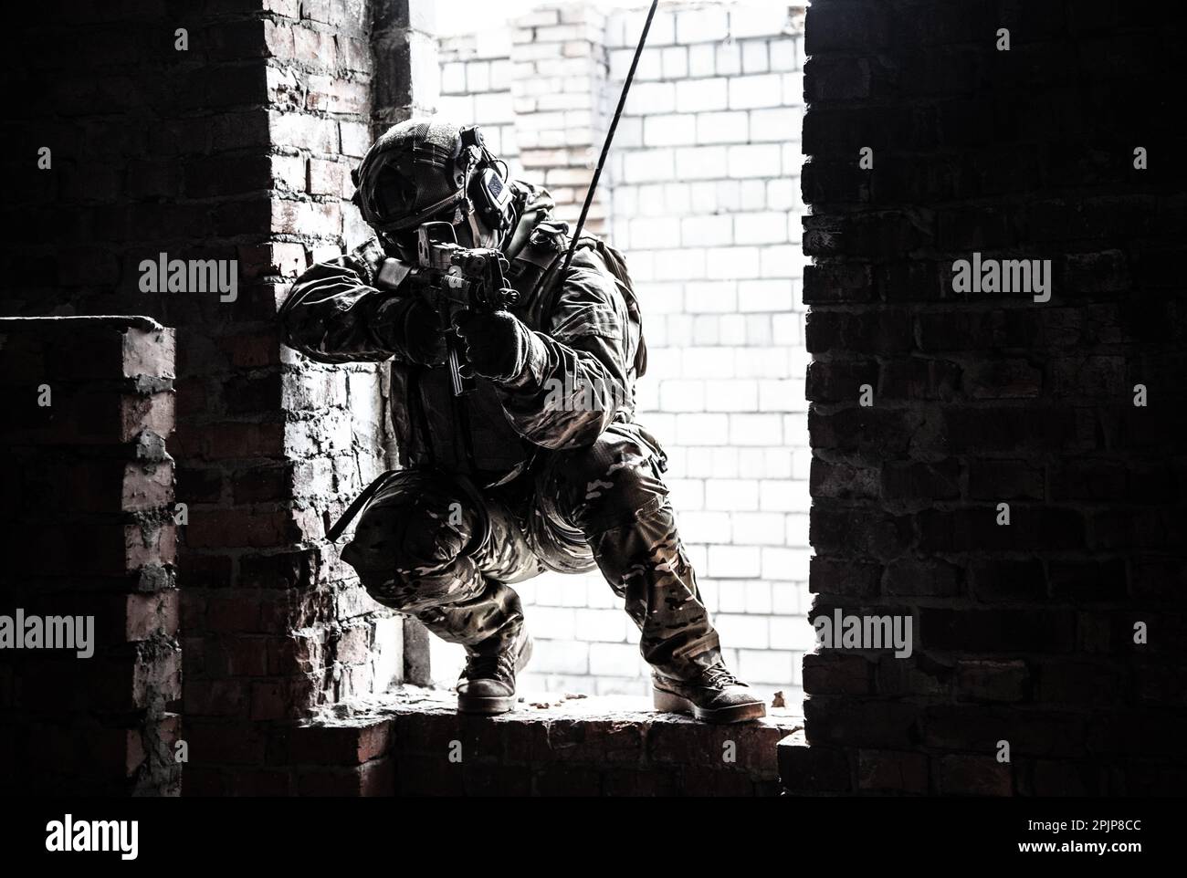 Black and white image of rappeller - police officer or soldier in ...