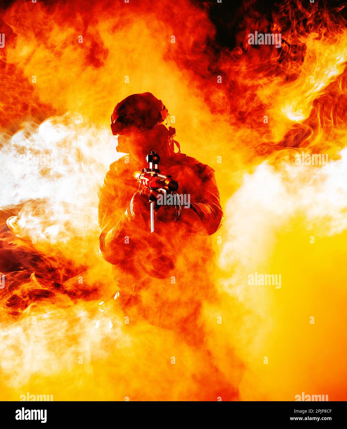 A silhouette of a soldier in fire and smoke, danger and intensity of ...