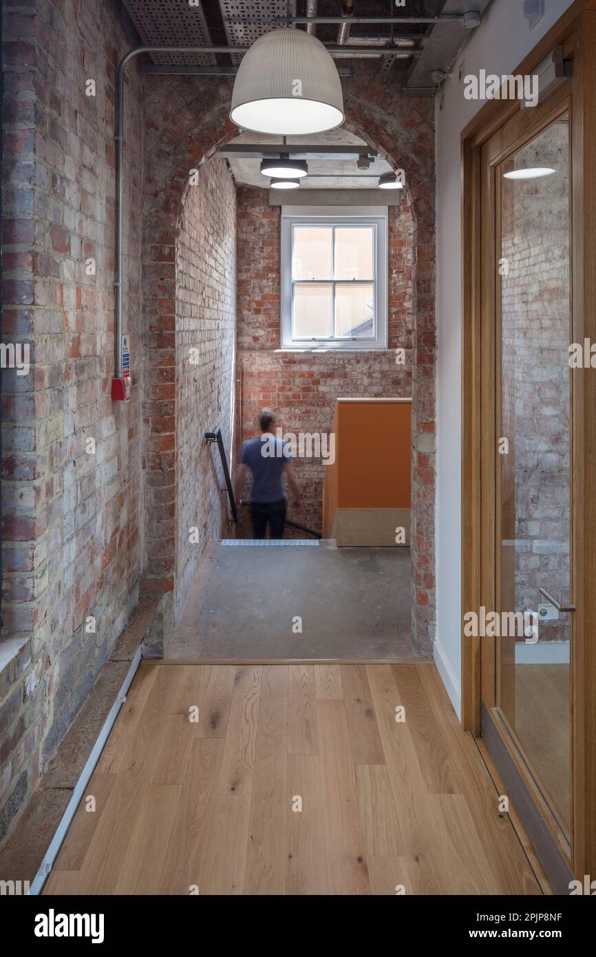 Upper level corridor with the historical building materials visible ...