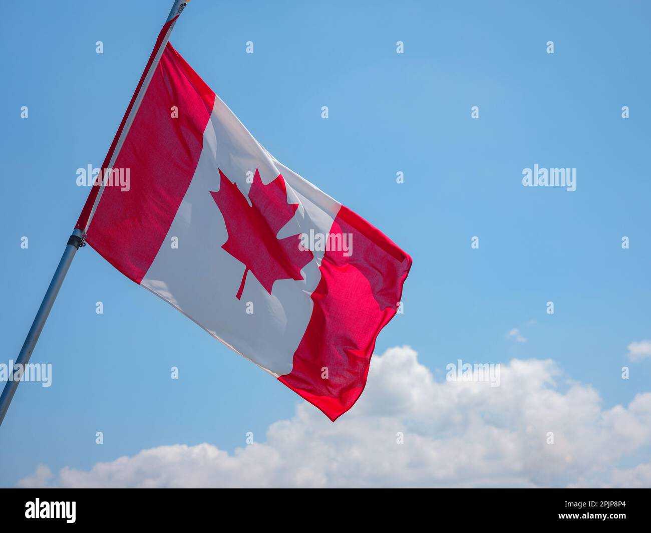 Beautiful Canada flag is waving front of historical street in Basel ...