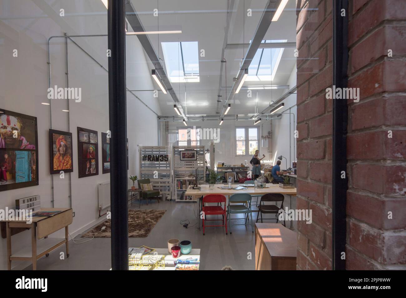 Looking through a large glass window in to an artists studio. Whitby ...