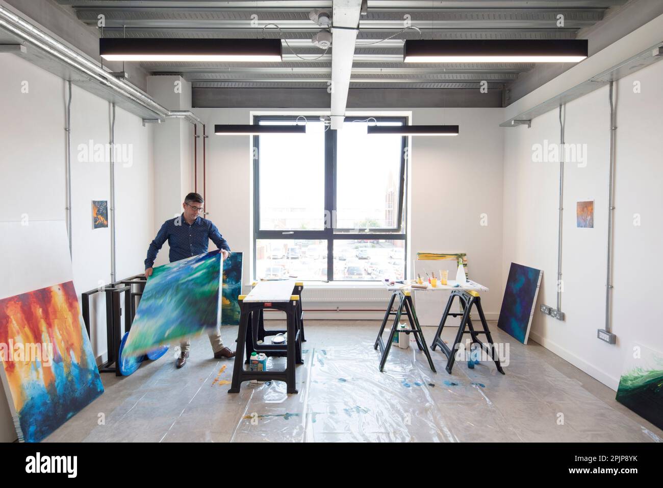 Artist working in one of the upper level art studios. Whitby Street ...