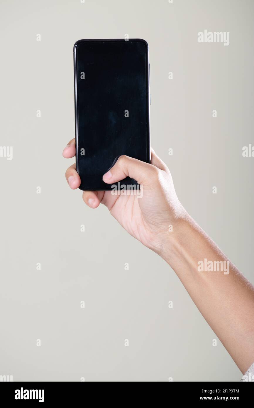 Black hand smartphone hi-res stock photography and images - Alamy