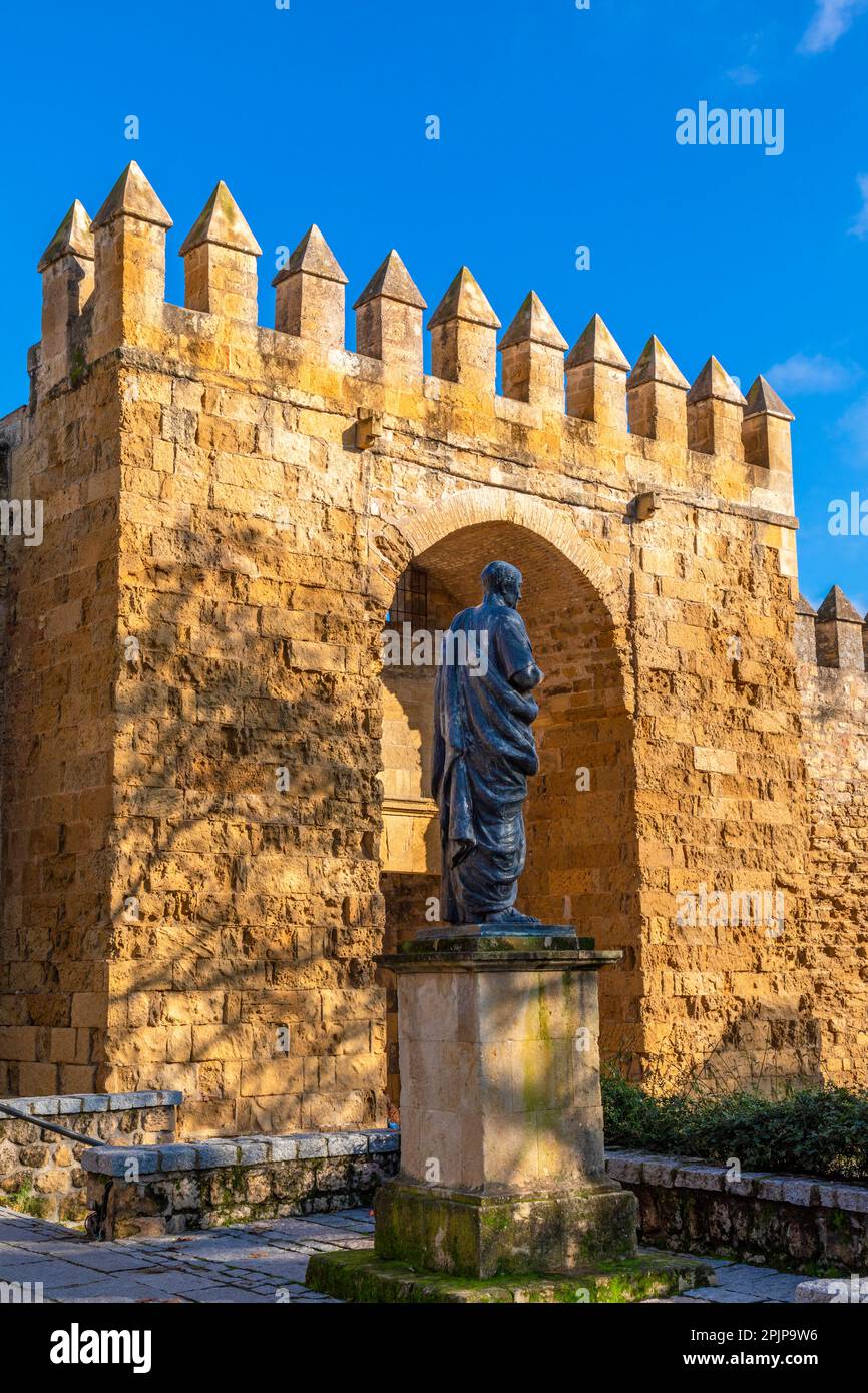 Statue of Seneca with the Almodovar Gate and Walls of Cordoba built in ...