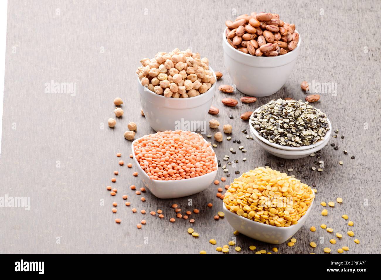 Assorted uncooked gram and lentils on table Stock Photo - Alamy