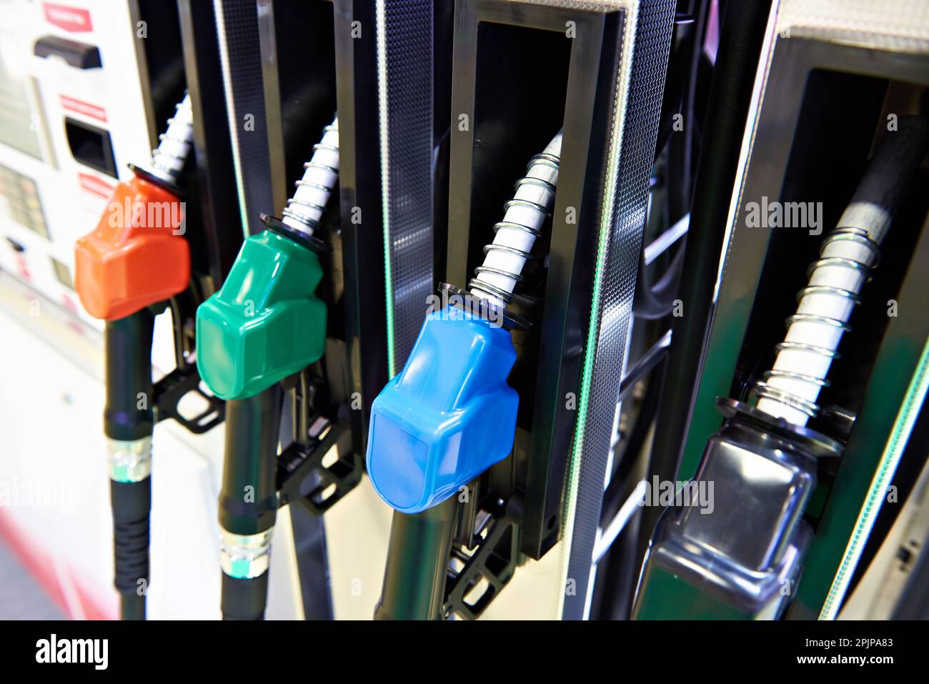 Fuel nozzles on filling station Stock Photo - Alamy