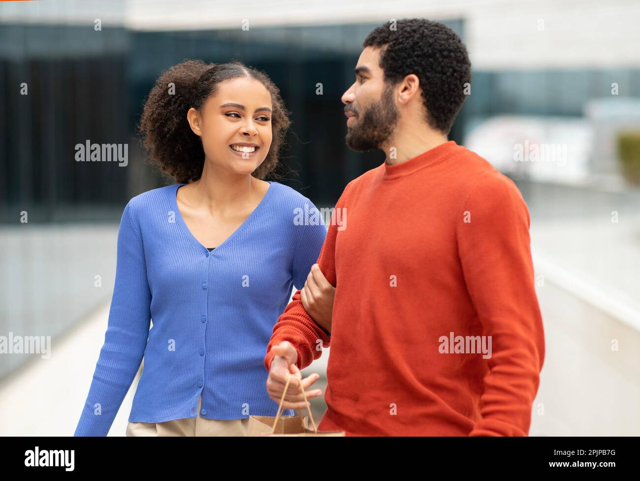 Cheerful Couple Shopping Together Walking Holding Hands Carrying Bags ...