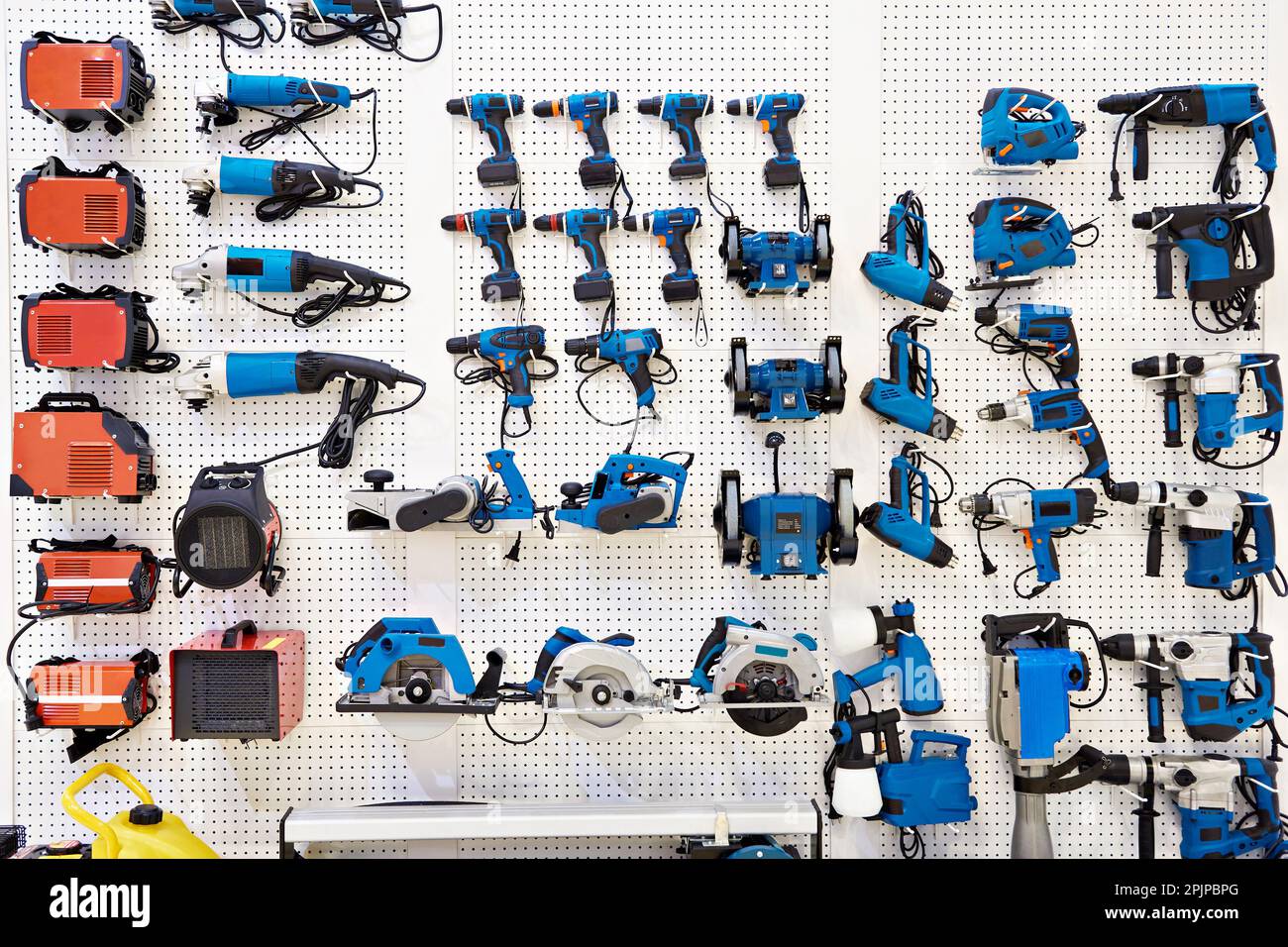 Drills and electrical tools on shelves in hardware store Stock Photo ...