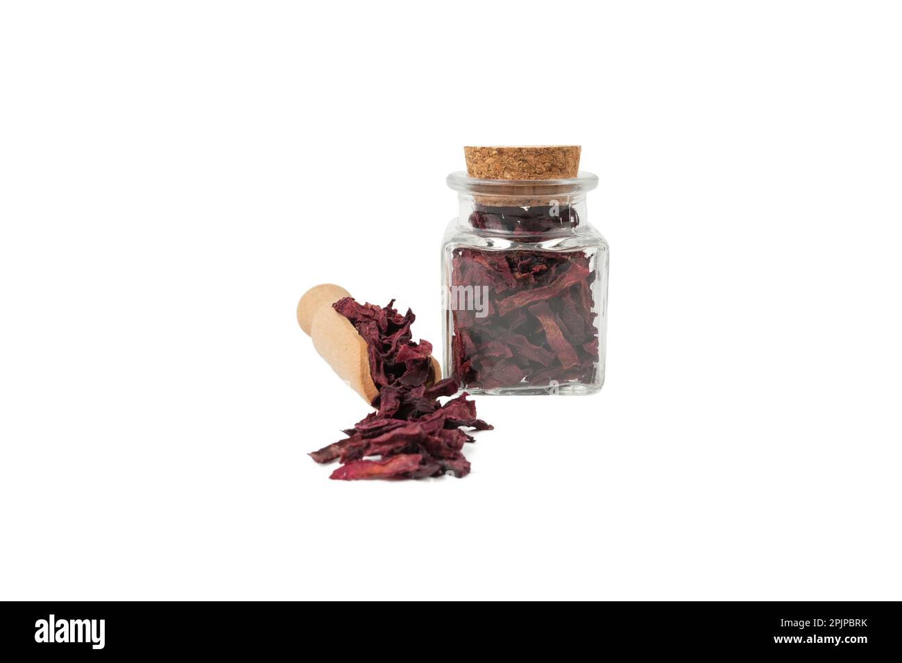 Dried beetroot slices in wooden scoop and glass jar isolated on white ...