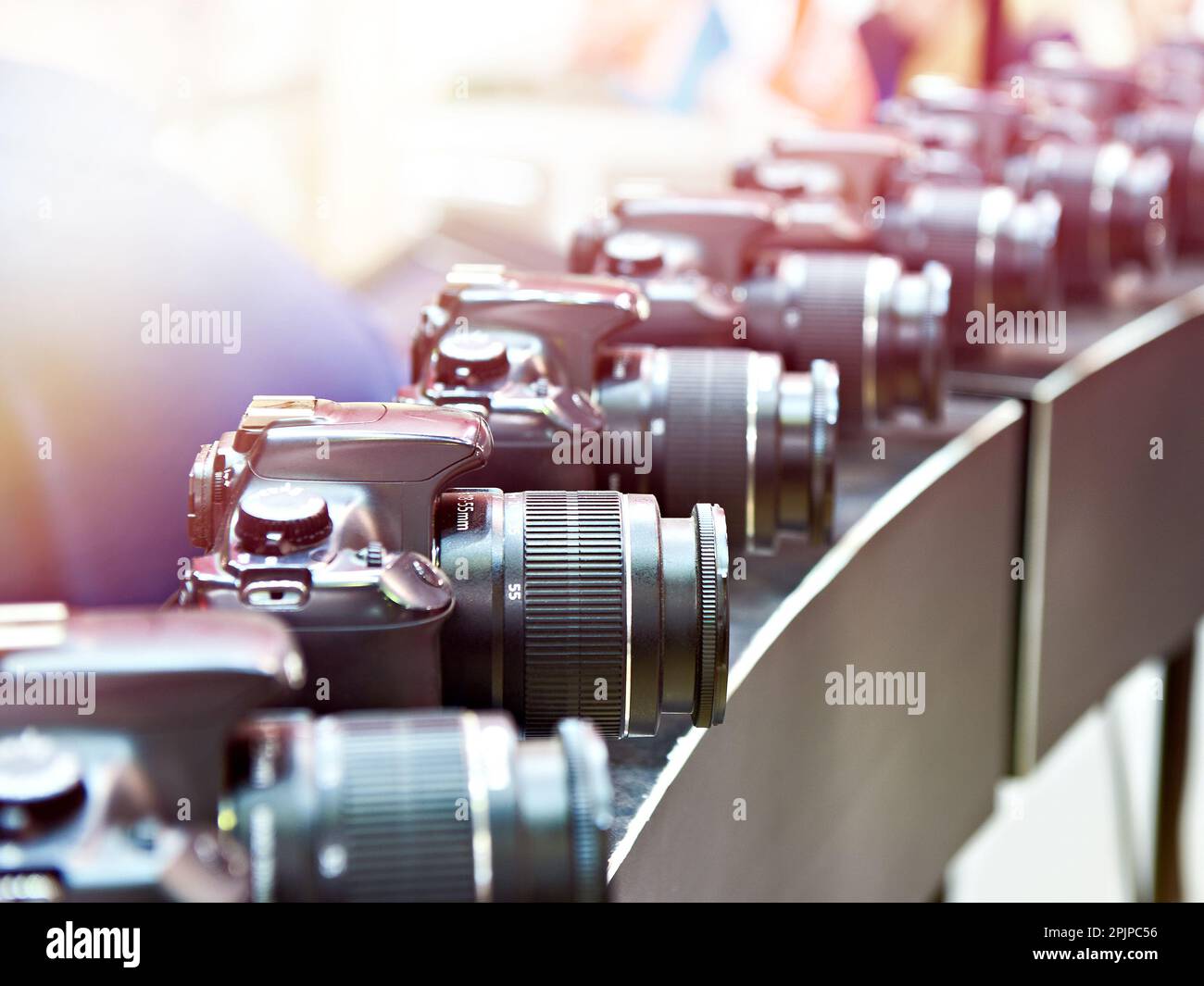 SLR digital cameras in a row Stock Photo - Alamy
