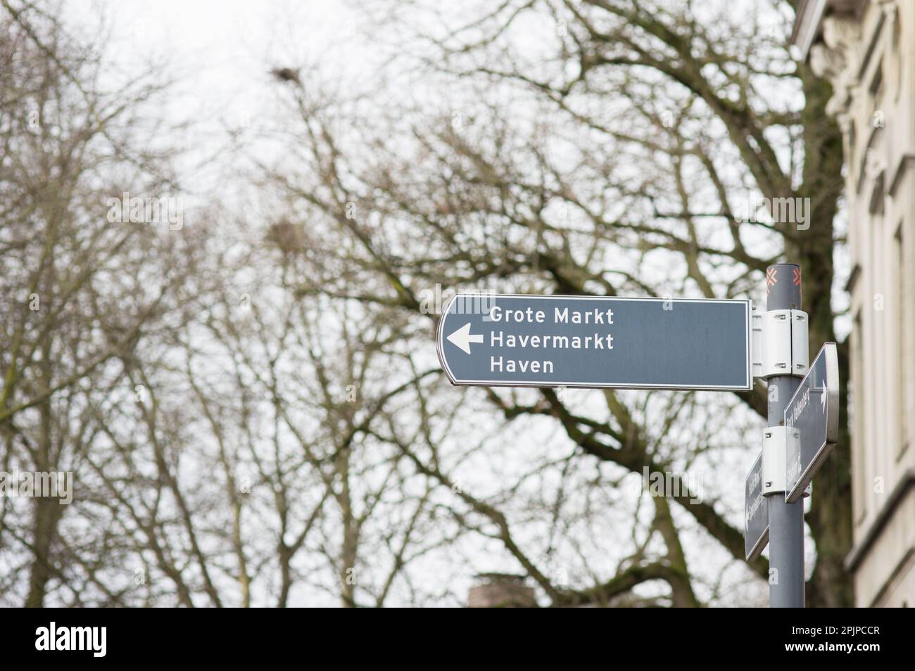 Pole with a blue signpost in the center of Breda in the Netherlands ...