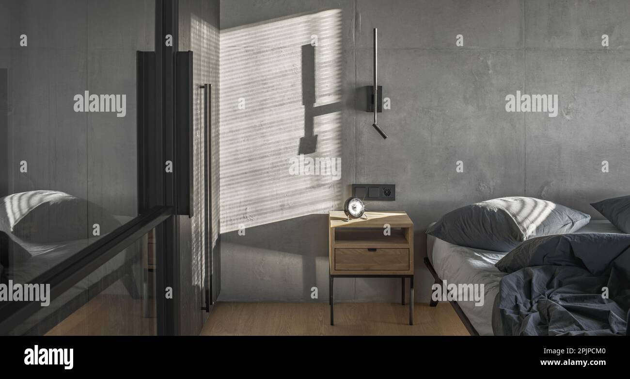 Minimalistic black wall light in modern bedroom interior in grey and ...