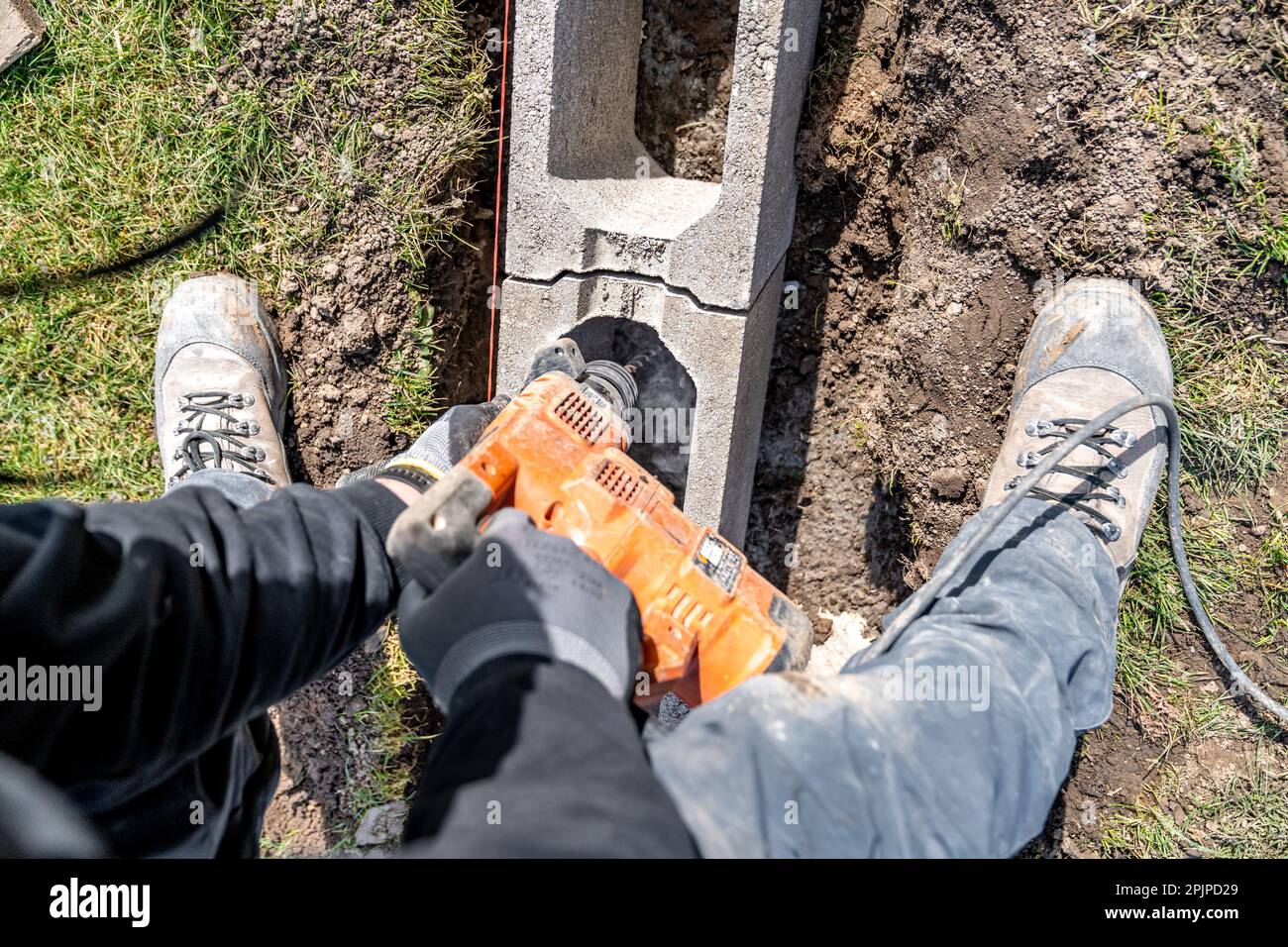 Drilling concrete foundations electric drill hi-res stock photography ...