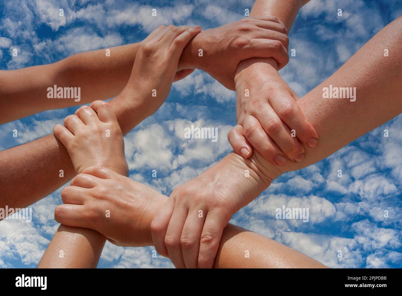 Many hands of people connect or link together community of cooperation ...