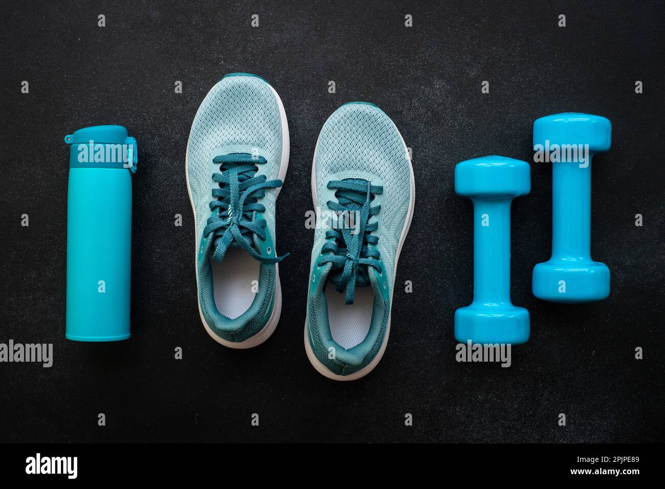 Fitness equipment at black background top view Stock Photo - Alamy