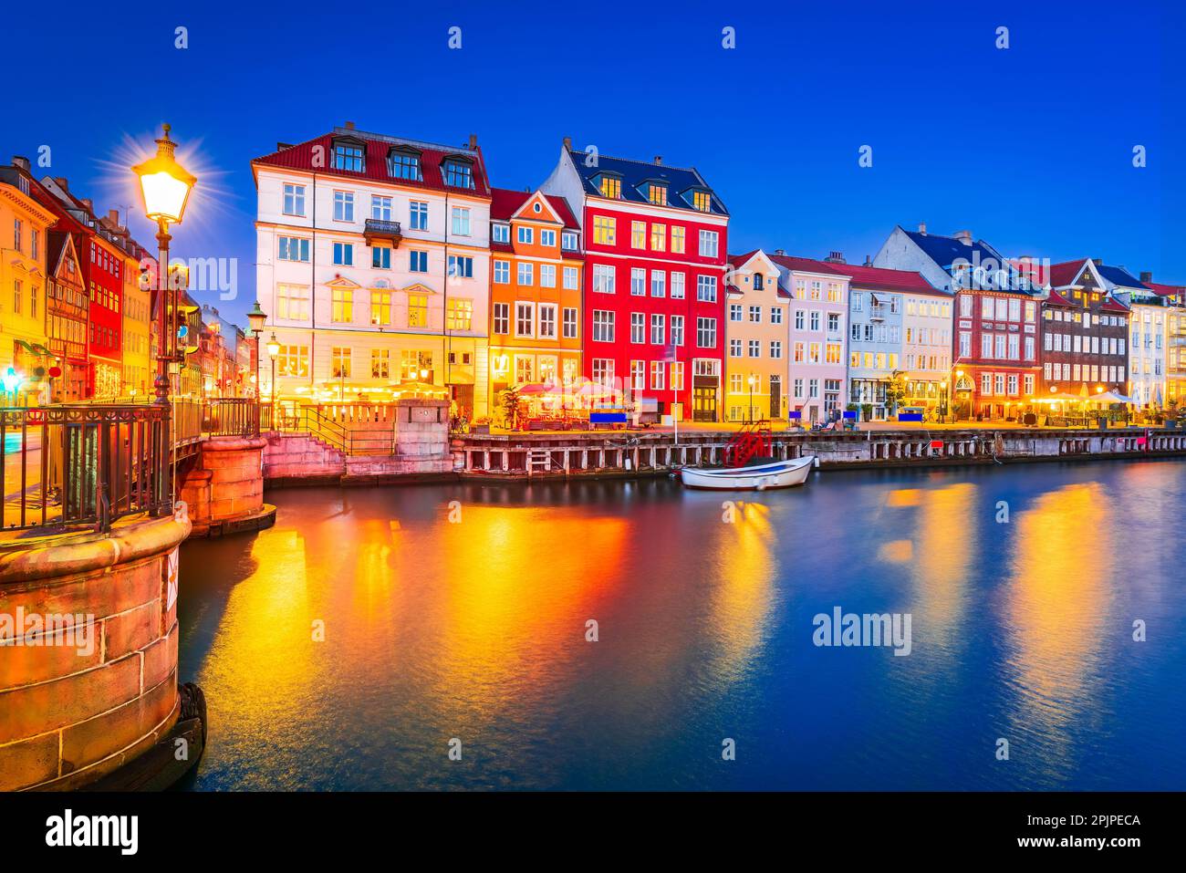 Charm of Copenhagen, Denmark at Nyhavn. Iconic canal, colorful night ...