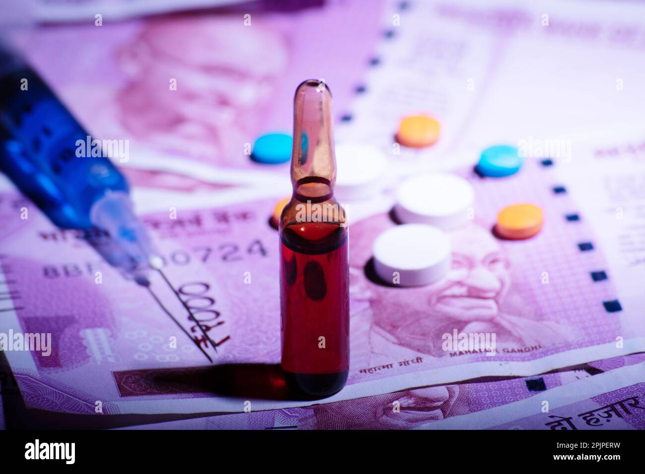Injection vial and syringe with indian currency Stock Photo - Alamy