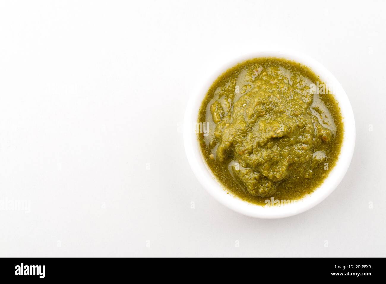 Top view of green chutney isolated on white background Stock Photo - Alamy