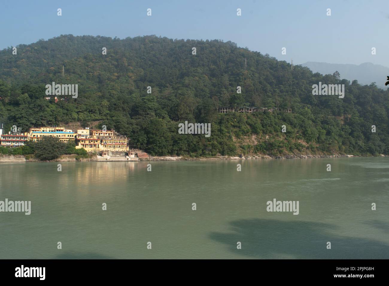 Holy river ganga with green mountains at rishikesh Stock Photo - Alamy