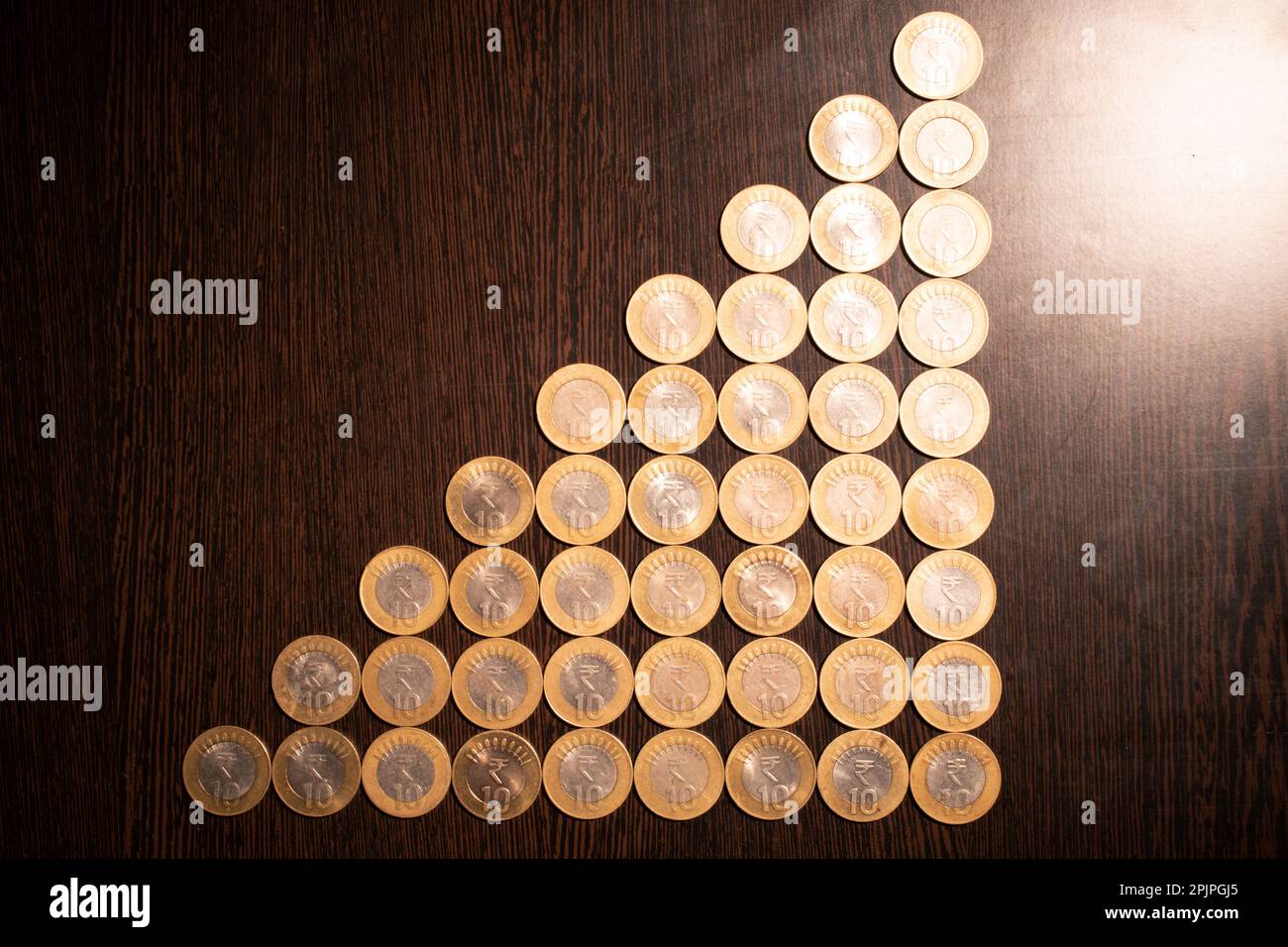 Top view of indian currency coin graph and table Stock Photo - Alamy