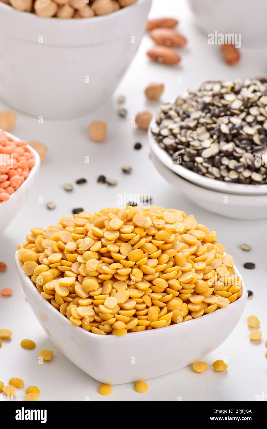 Raw chana dal in bowl on white background Stock Photo - Alamy