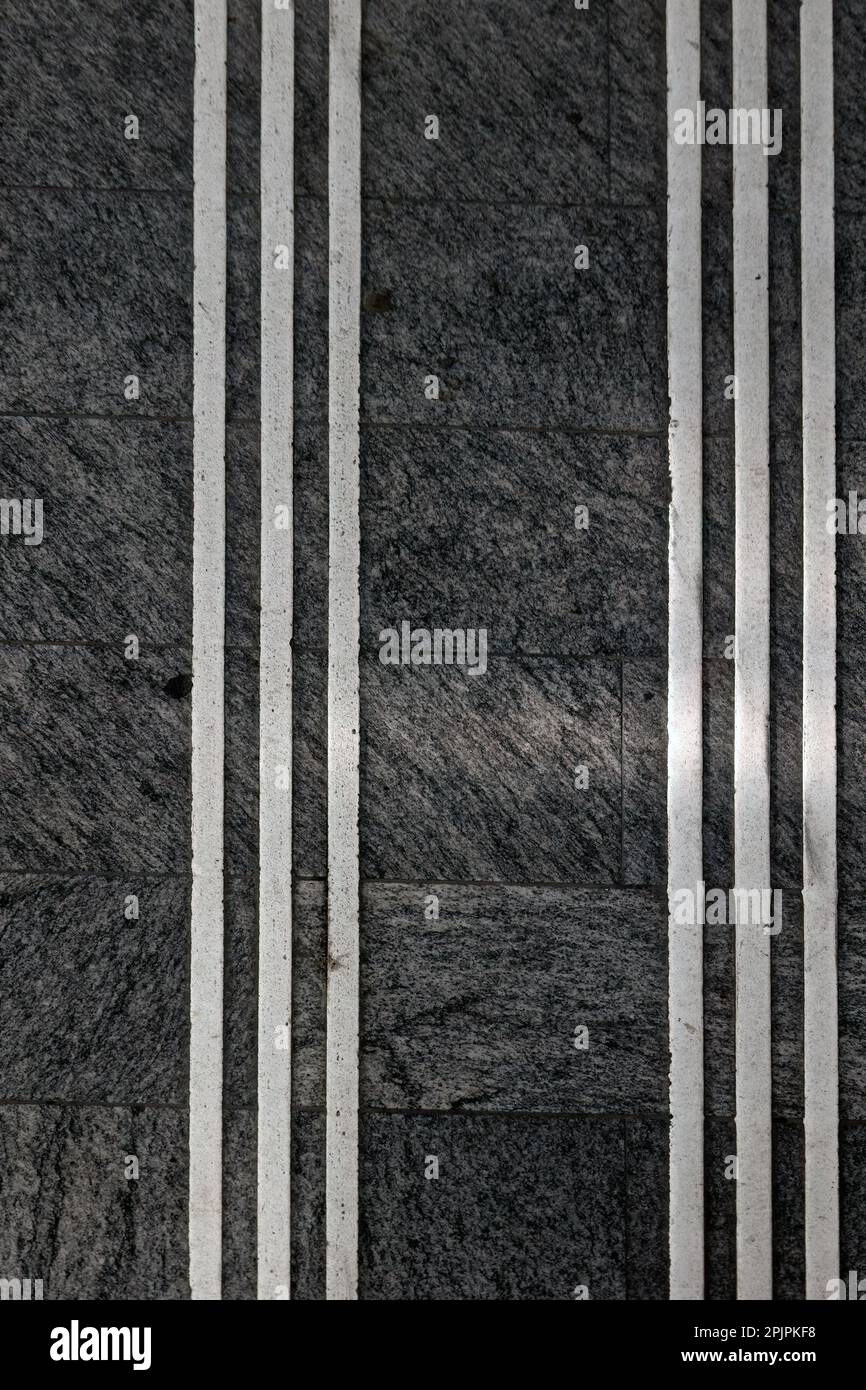 White lines on grey stone floor tiles for use as a background texture ...